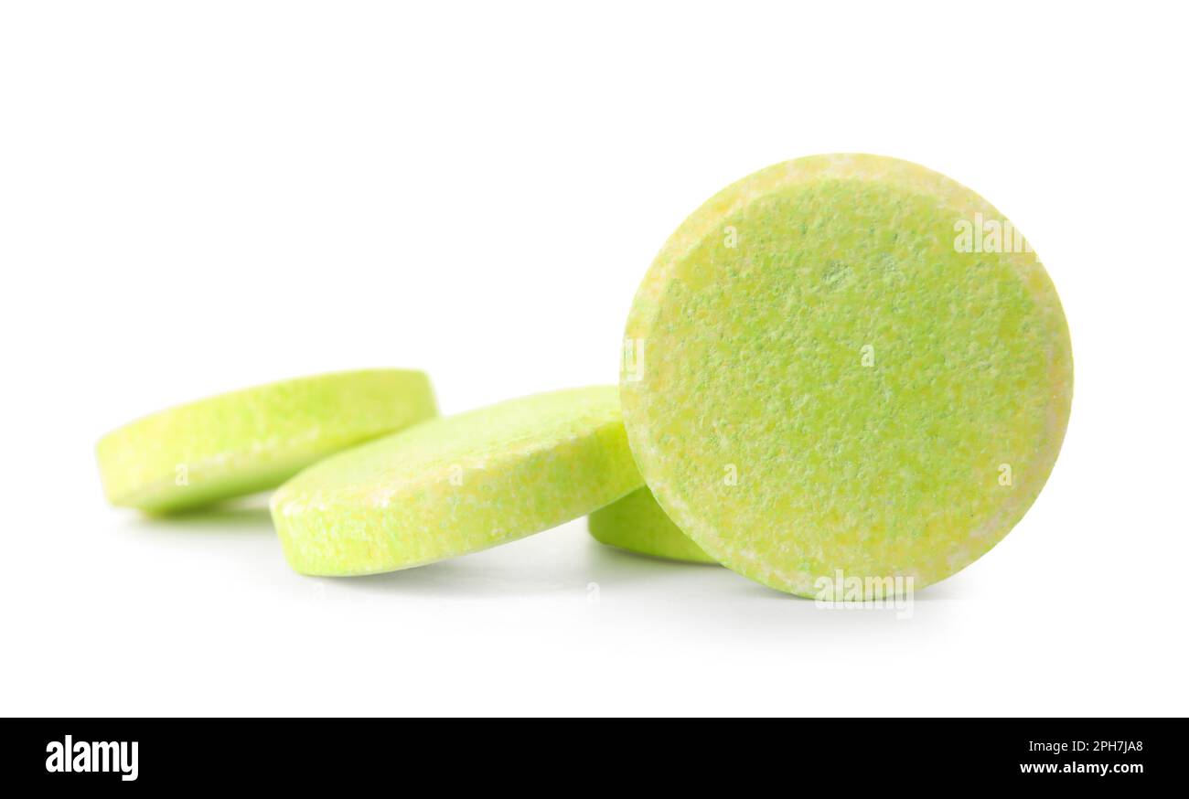 Green soluble tablets isolated on white background Stock Photo - Alamy