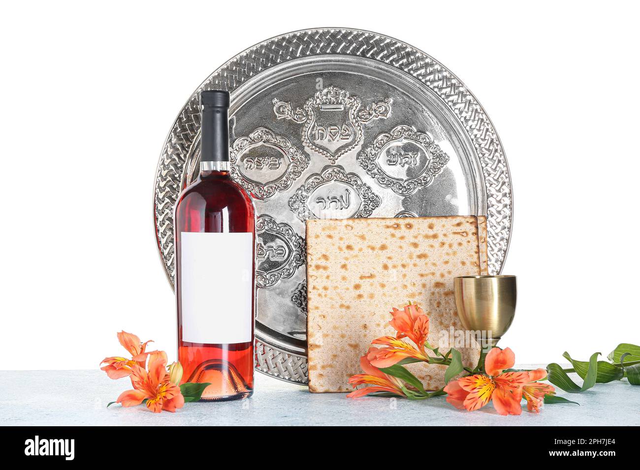Passover Seder plate, bottle of wine, cup, flatbread matza and ...