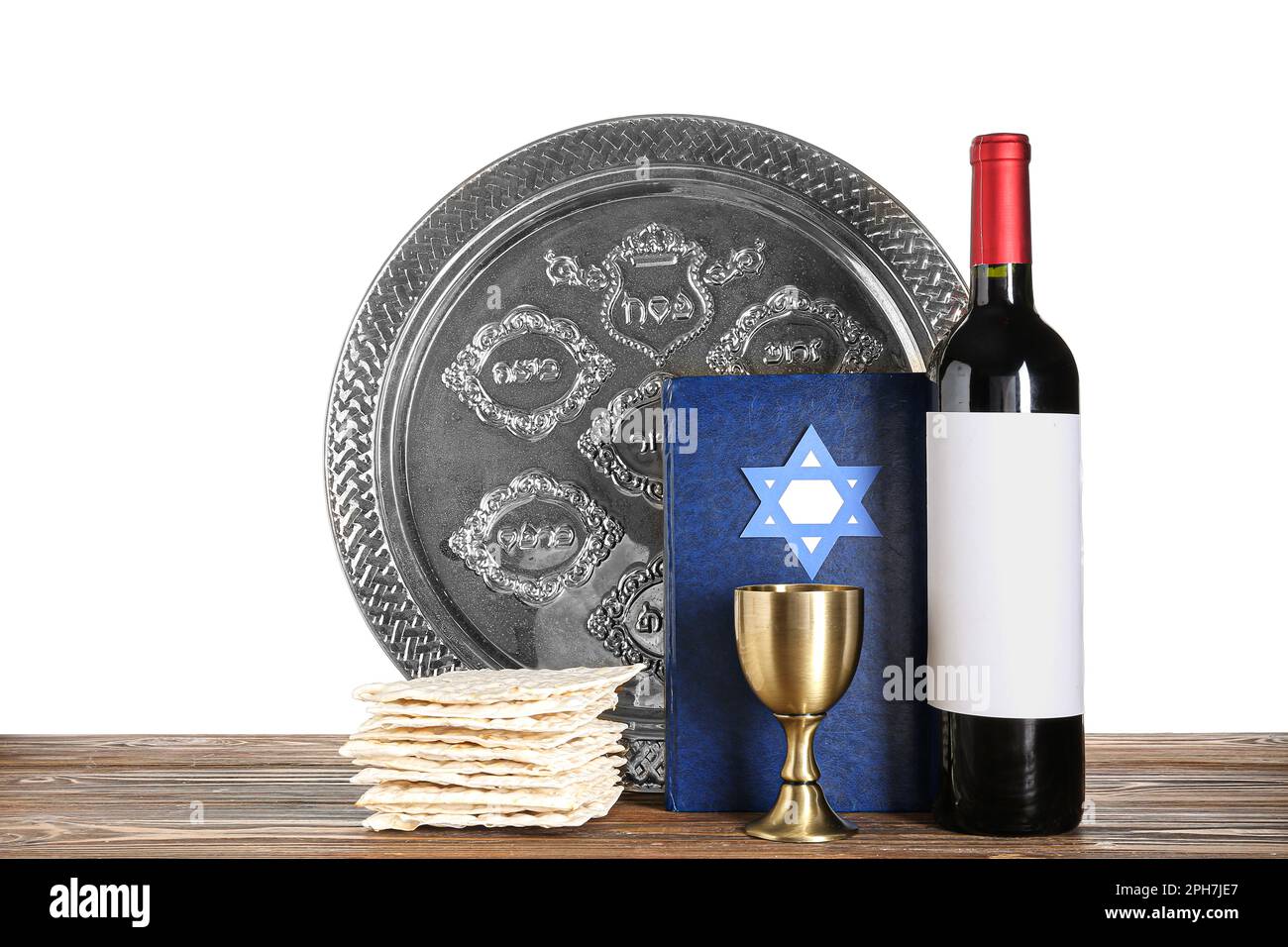 Bottle of wine, cup, Torah, Passover Seder plate and flatbread matza on ...