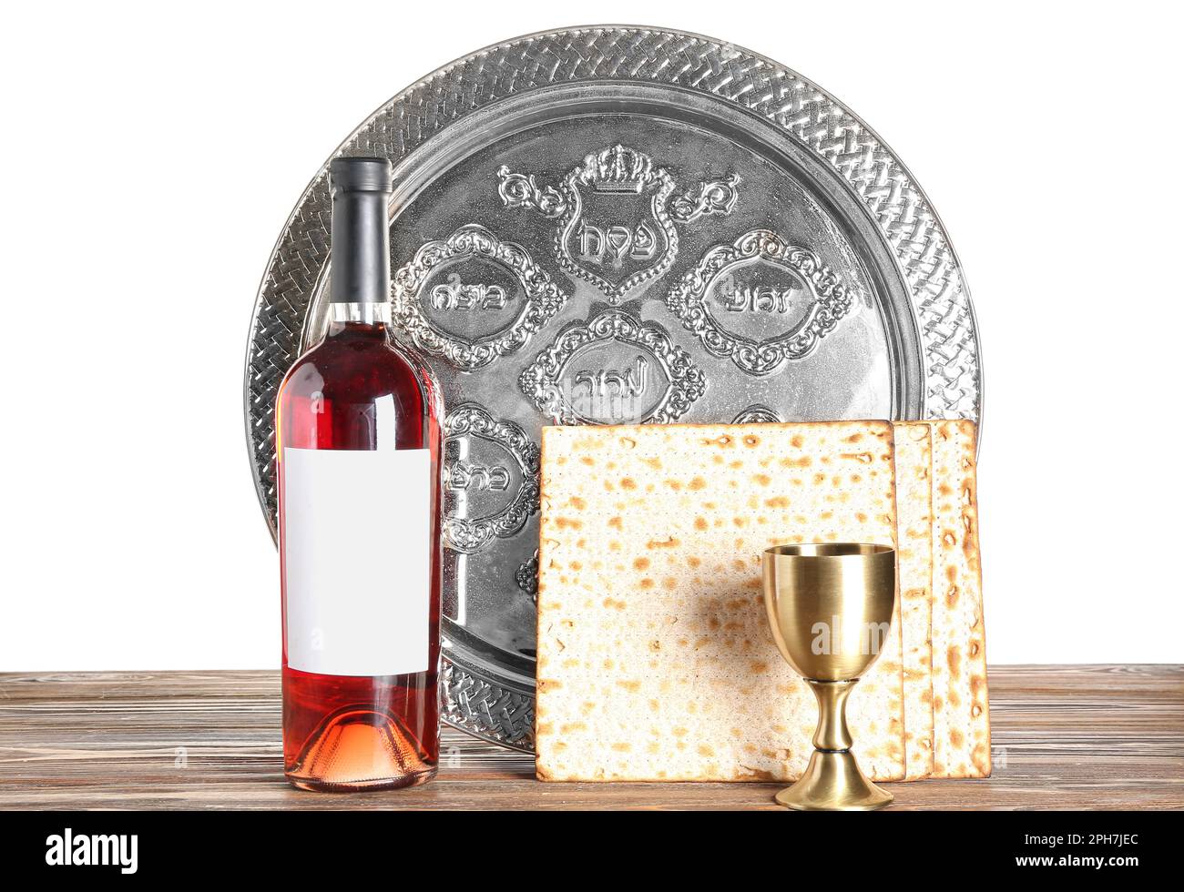 Bottle of wine, cup, Passover Seder plate and flatbread matza on wooden ...
