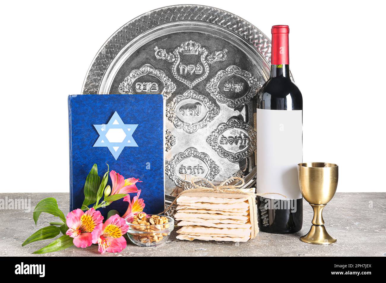 Passover Seder plate, Torah, flatbread matza, bottle of wine, cup and ...