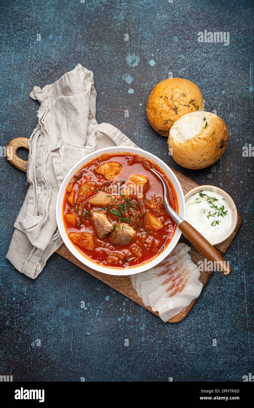 Ukrainian Borscht, red beetroot soup with meat, in white bowl with sour ...