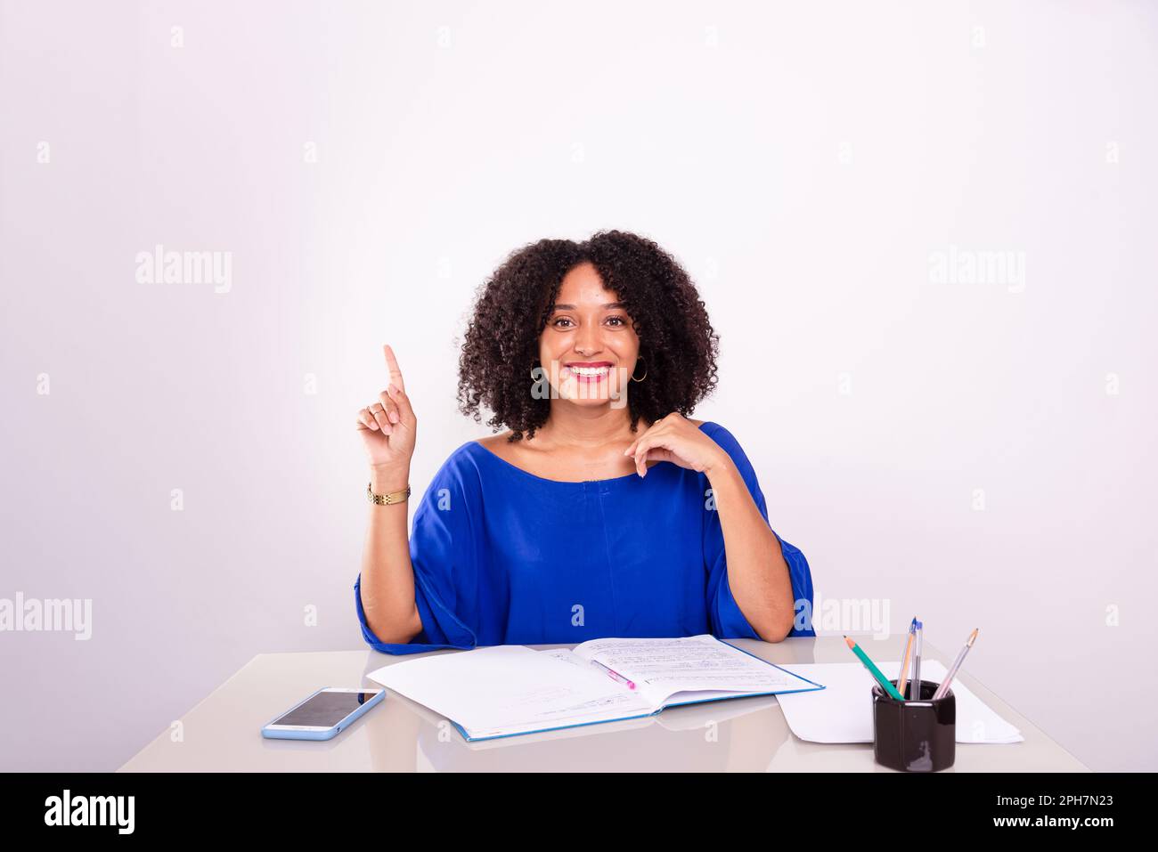 Young businesswoman in her home office making hand gestures. Isolated ...