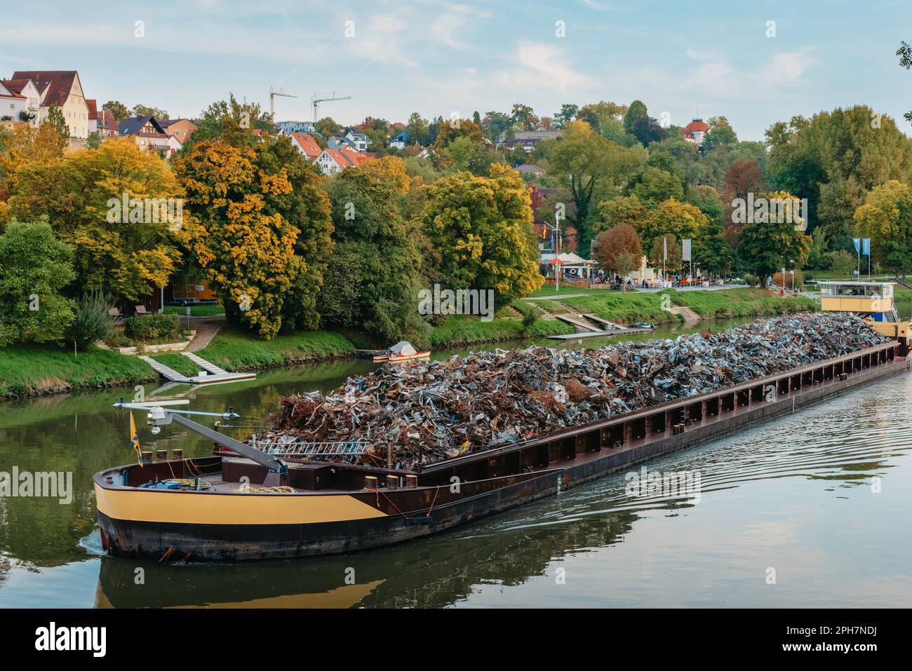 Transportation industry. Ship barge transports scrap metal and sand ...