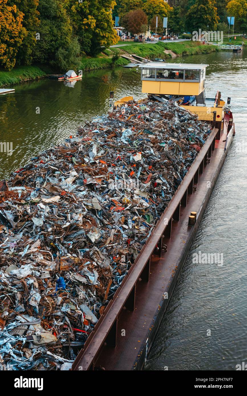 Transportation industry. Ship barge transports scrap metal and sand ...