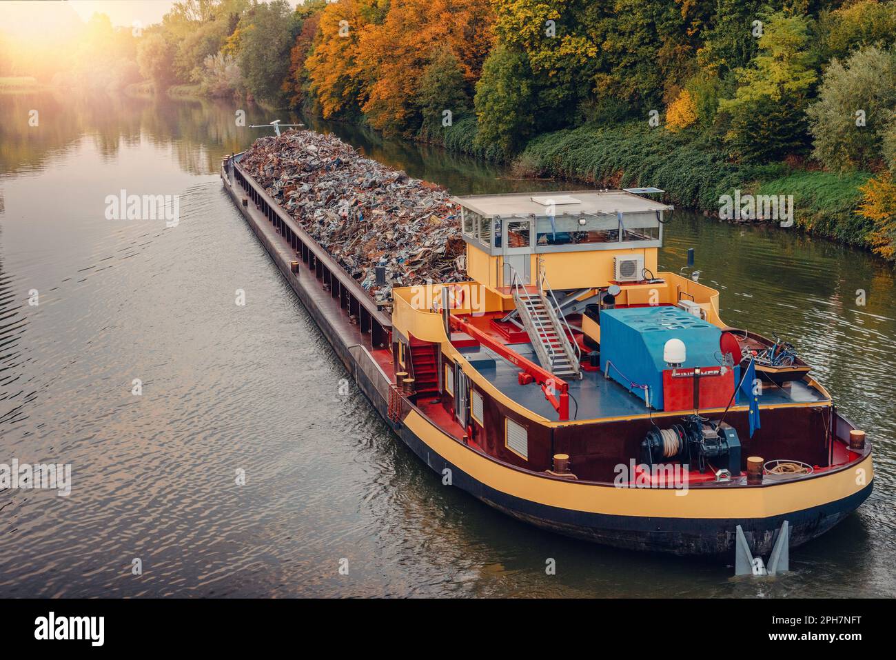 Transportation industry. Ship barge transports scrap metal and sand ...