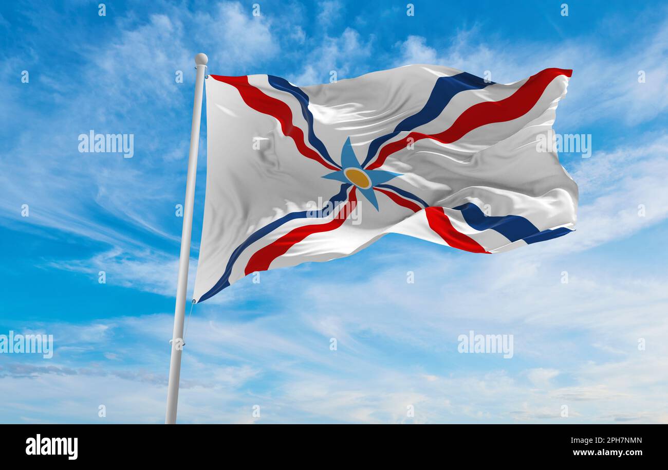 flag of the Assyrians waving in wind at cloudy sky. love holy spirit ...