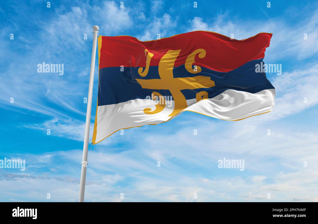 flag of the Serbian Orthodox Church waving in wind at cloudy sky. love ...