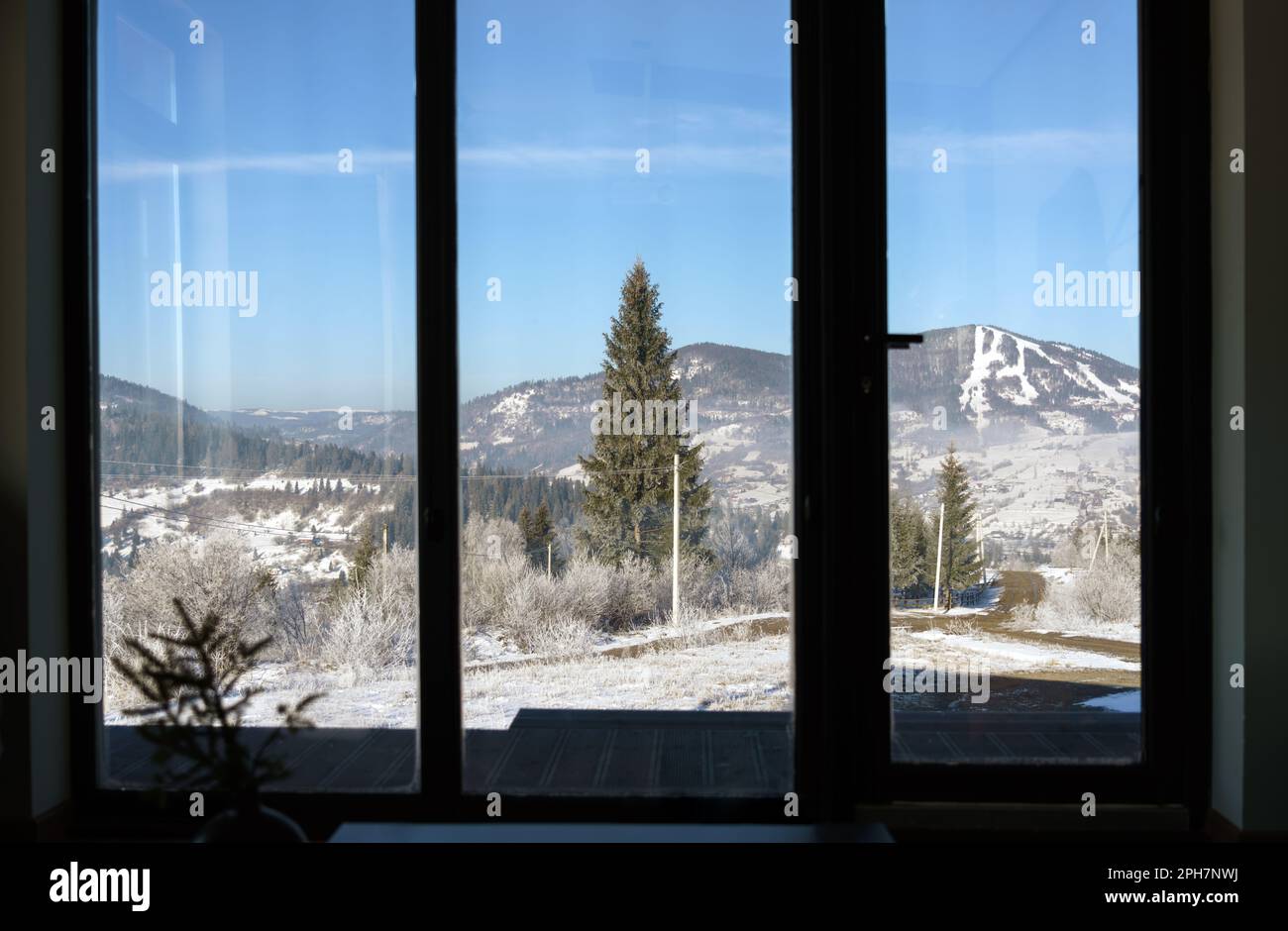 Snowy Mountain view from big window in Ukraine Stock Photo - Alamy