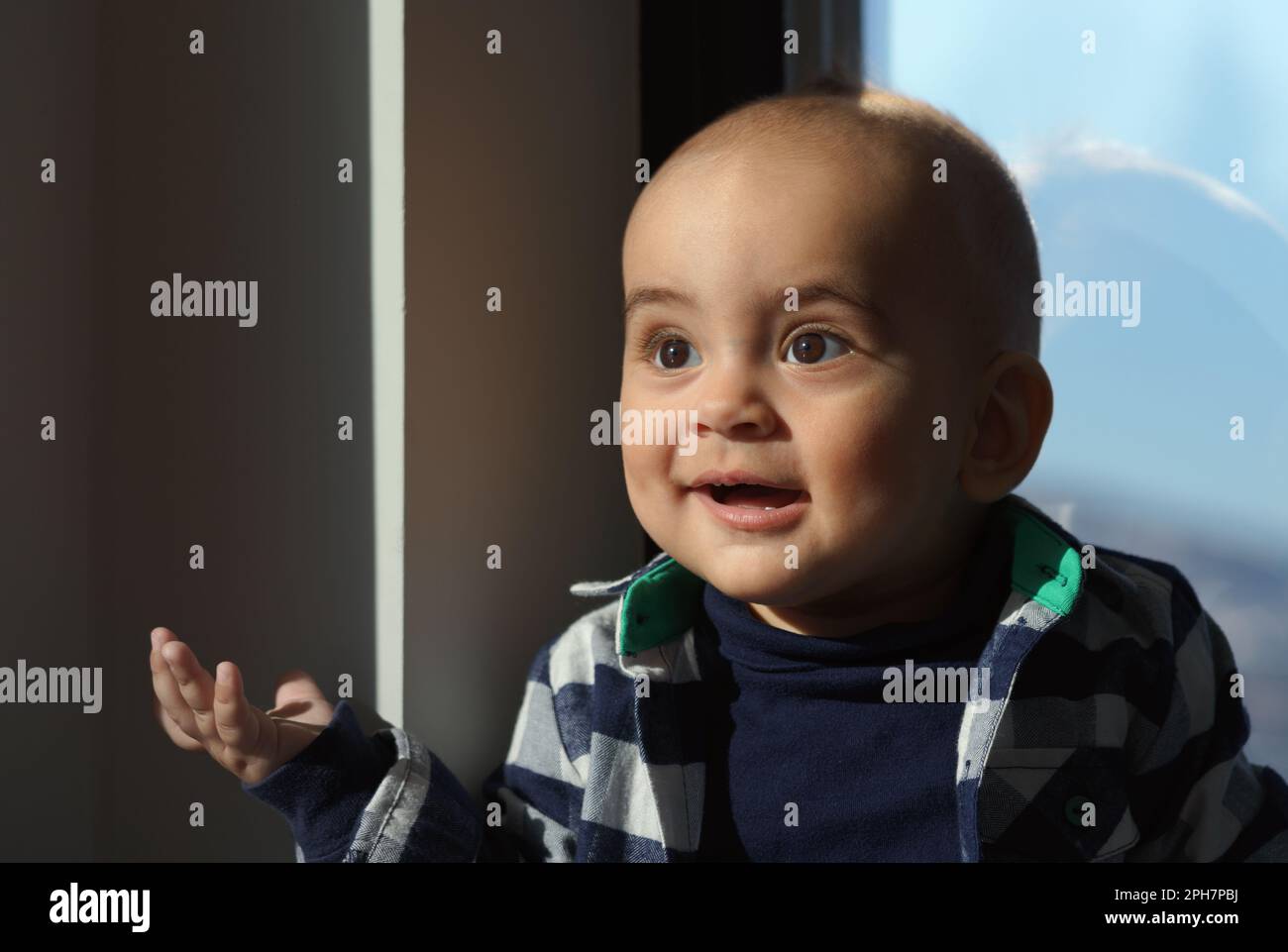 portrait of a kid with shocked face asking with hand gesture with copy ...