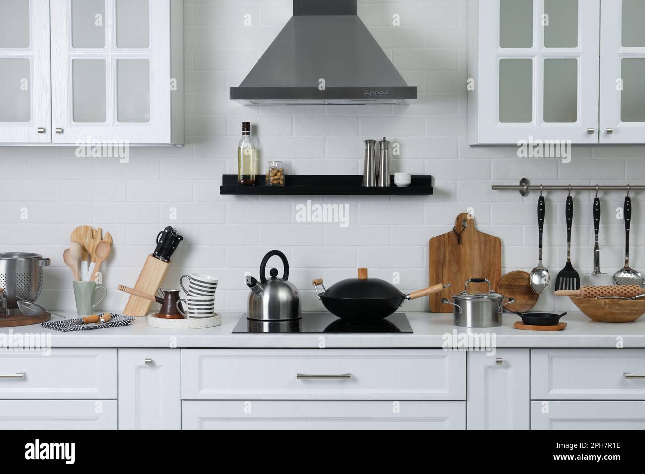 Countertop with different cooking utensils in kitchen Stock Photo - Alamy