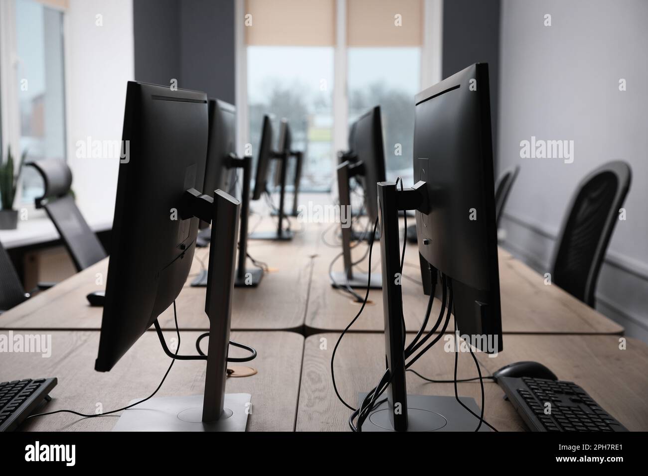 Rows of computers in empty office hi-res stock photography and images ...