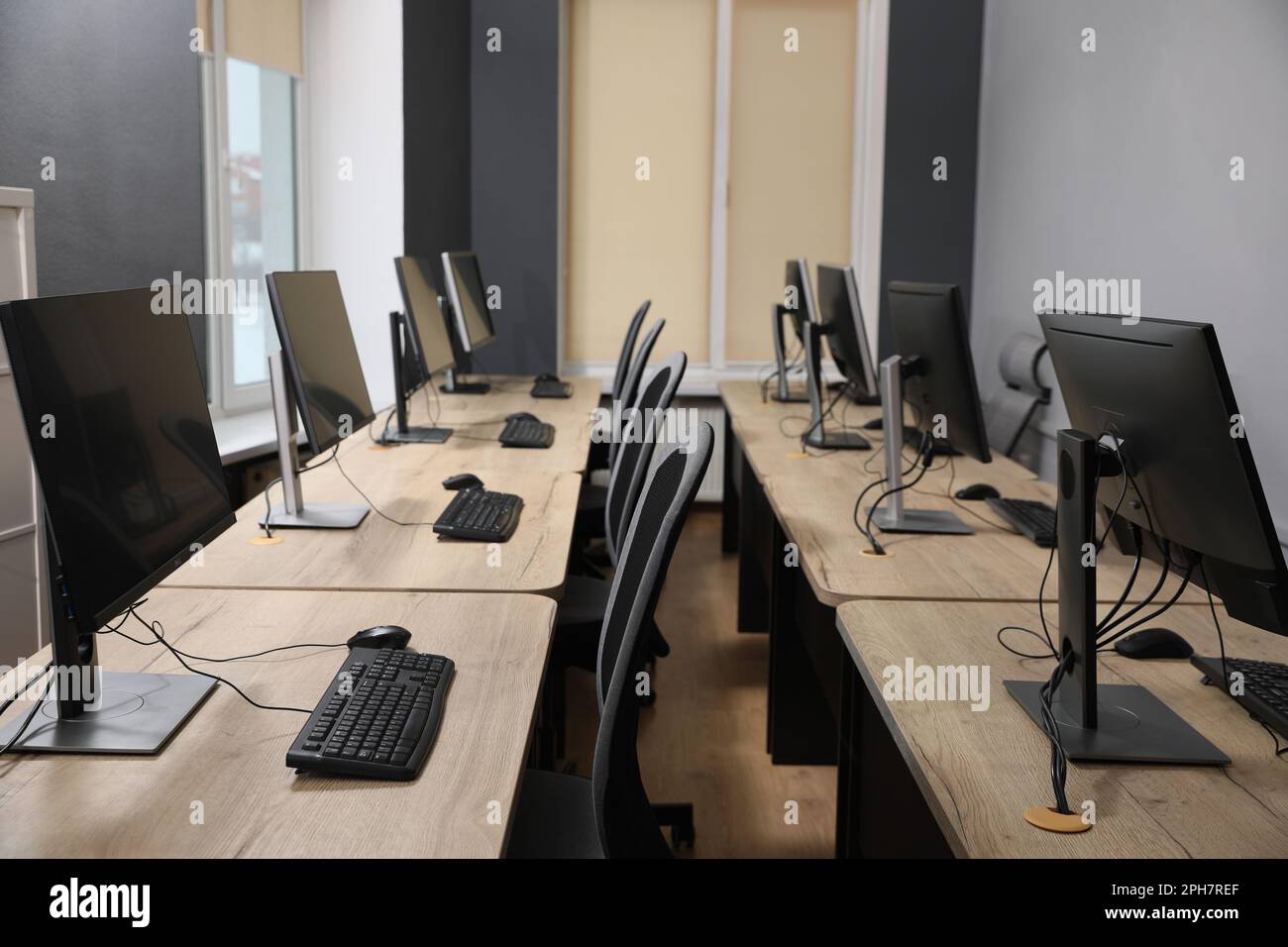 Rows of computers in empty office hi-res stock photography and images ...