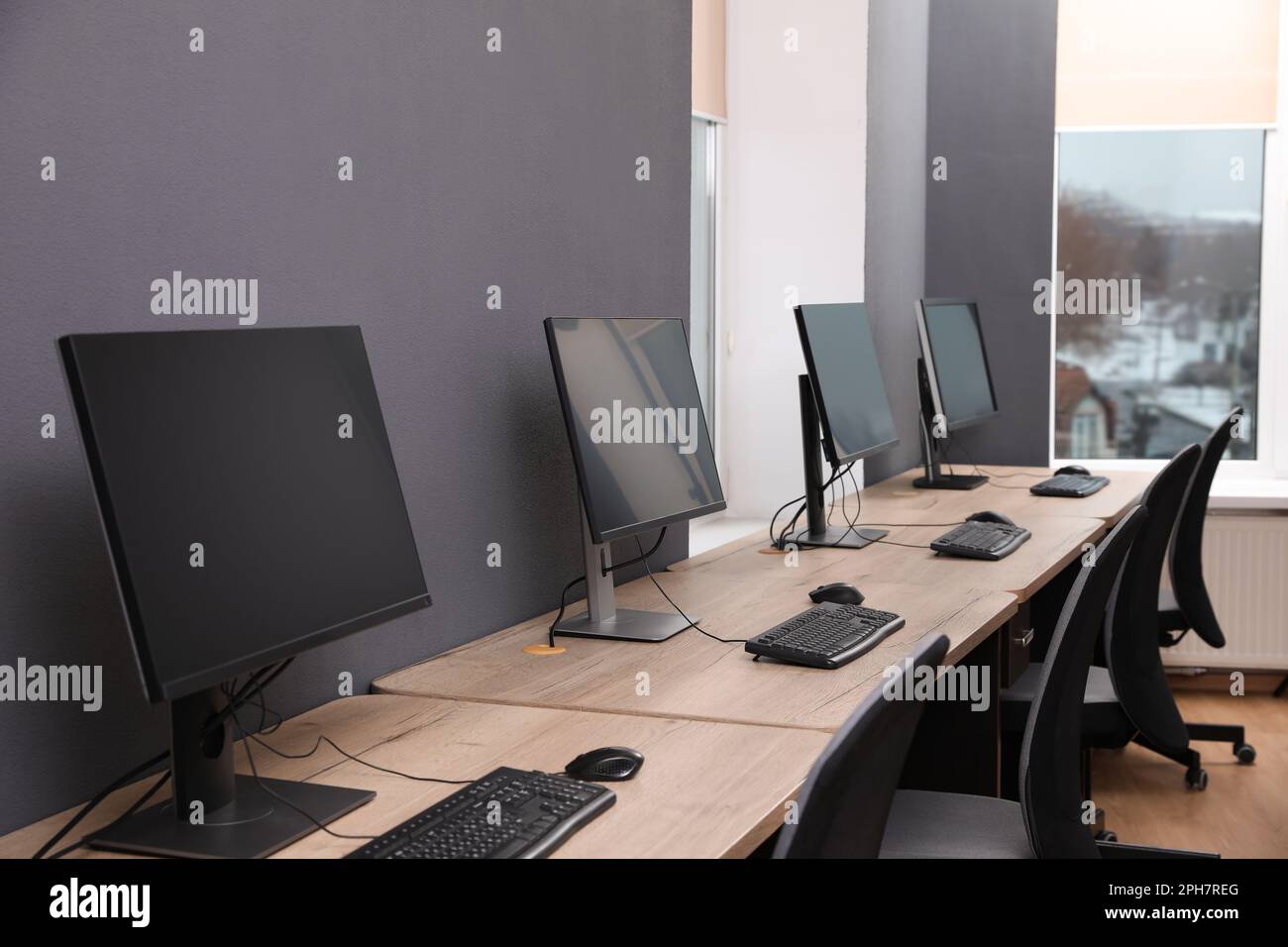 Many modern computers in open space office Stock Photo - Alamy