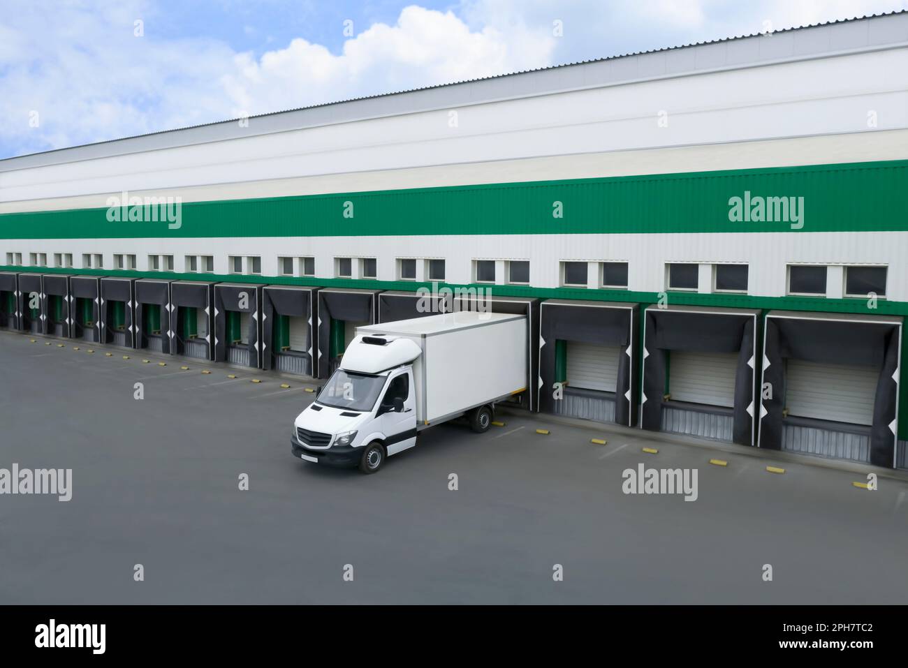 Truck near loading dock of warehouse outdoors, aerial view. Logistics ...