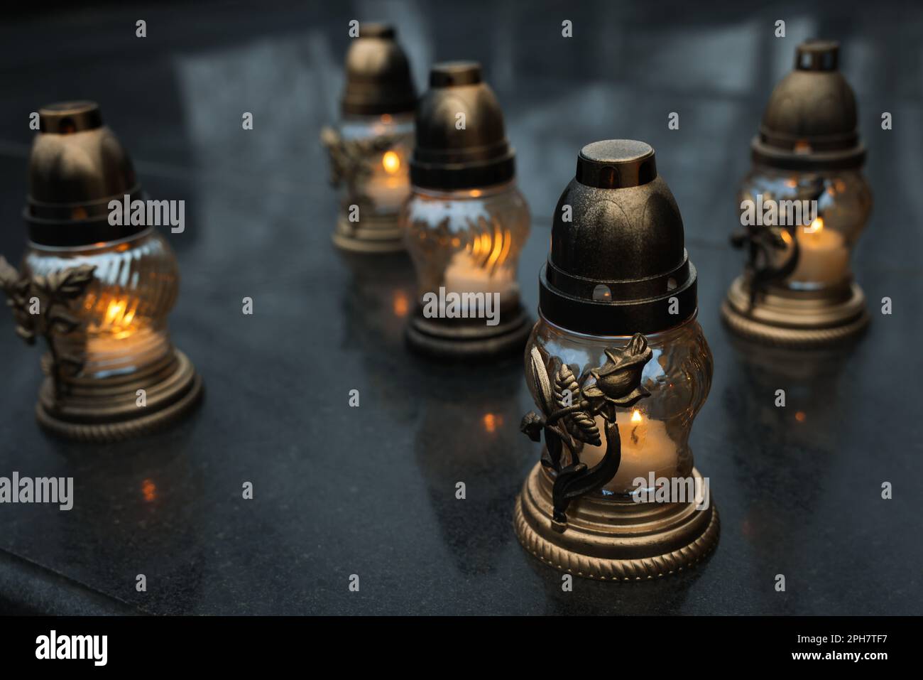 Grave lights on granite surface at cemetery Stock Photo - Alamy