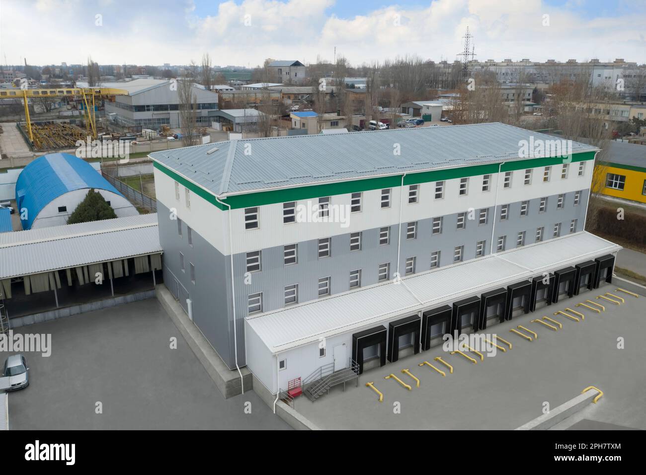 Aerial view of warehouse with loading docks outdoors. Logistics center ...