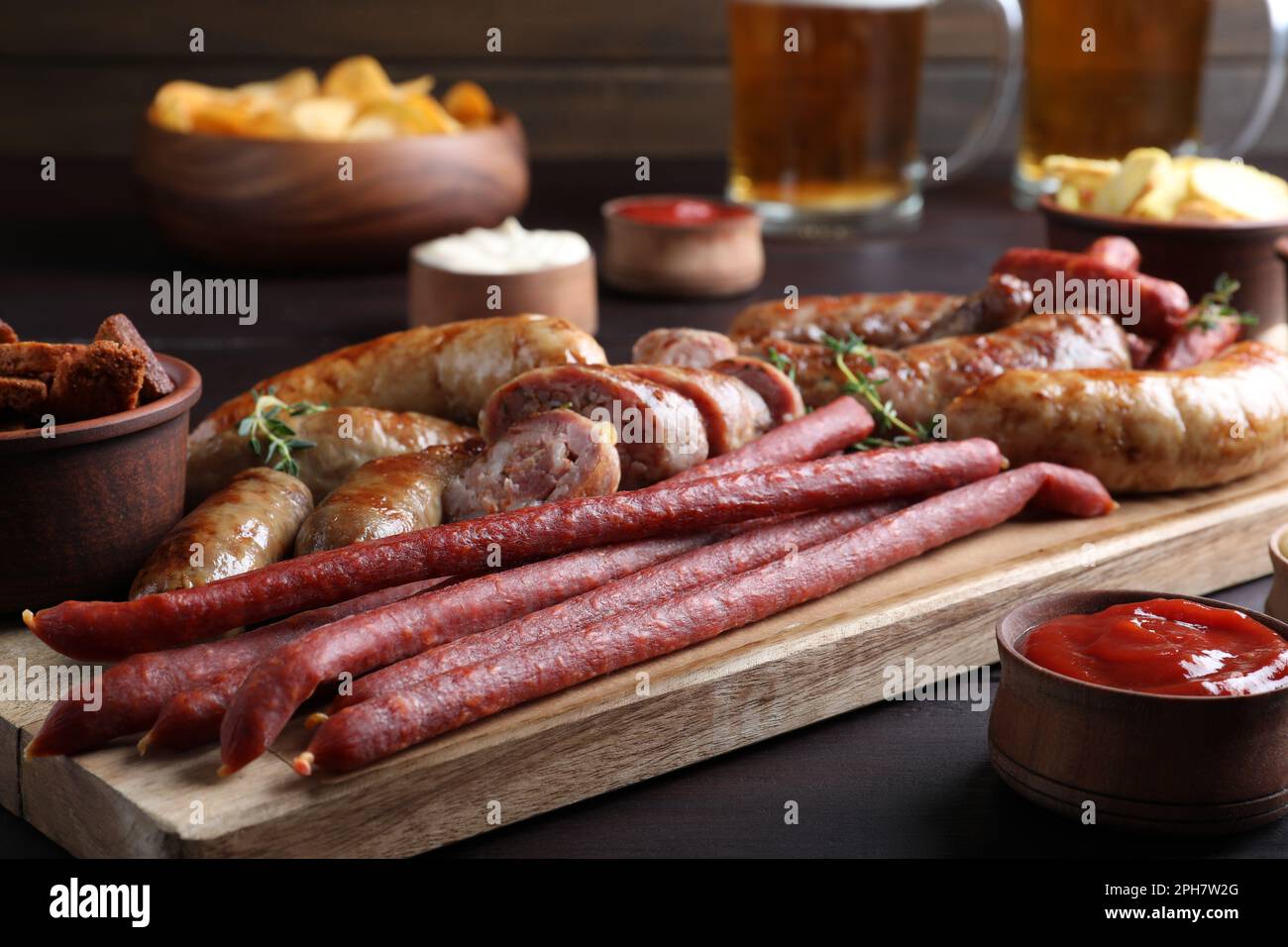 Set of different tasty snacks on wooden table, closeup view Stock Photo ...