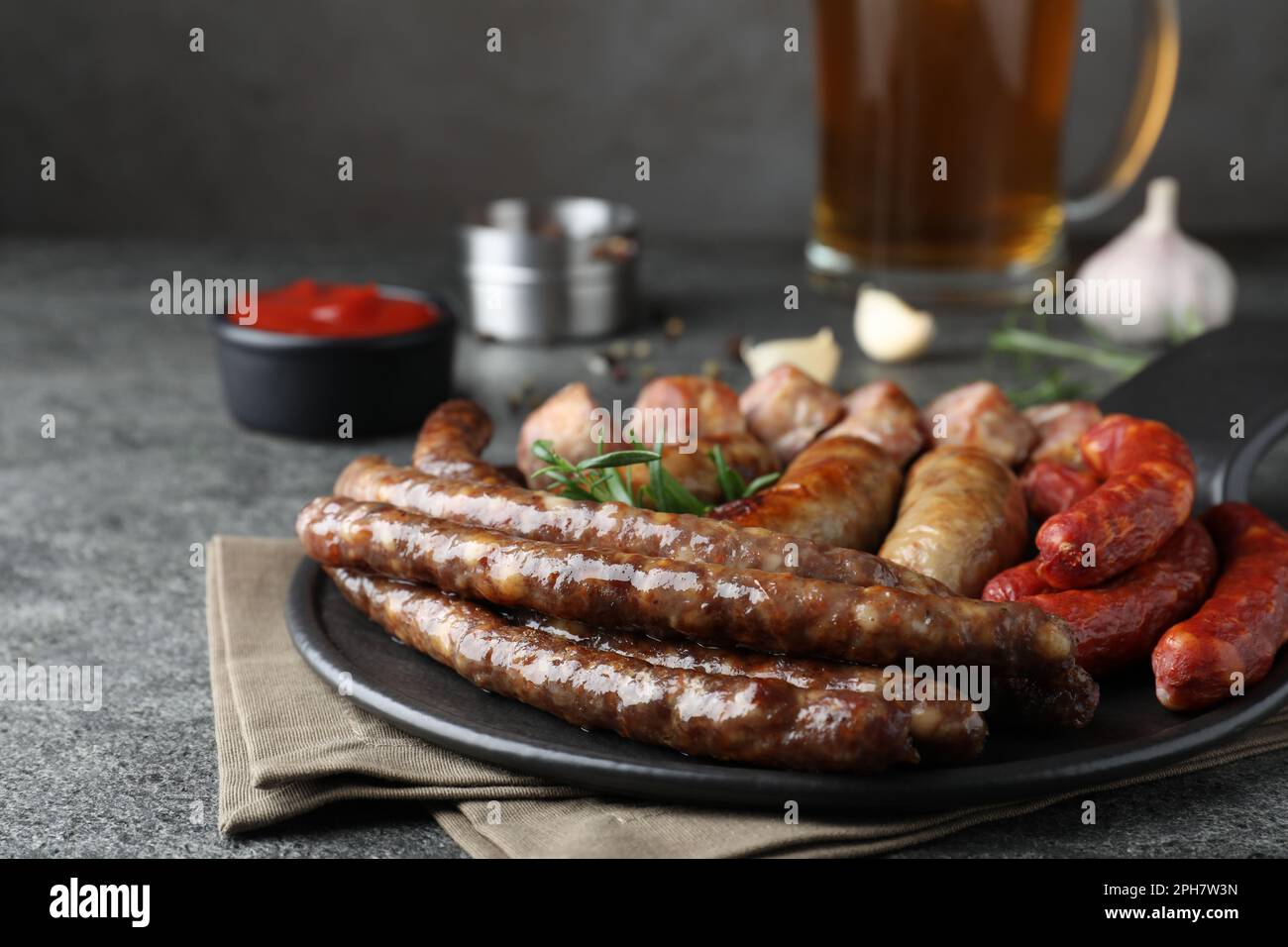 Set of different tasty snacks on dark grey table, closeup view Stock ...