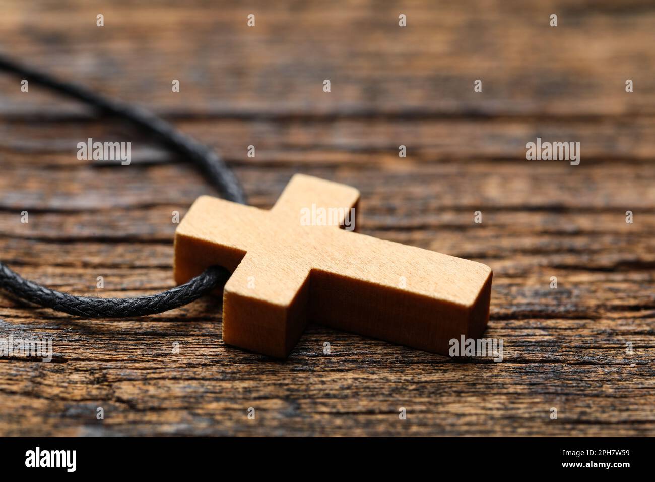 Wooden Christian cross on table, closeup view Stock Photo - Alamy