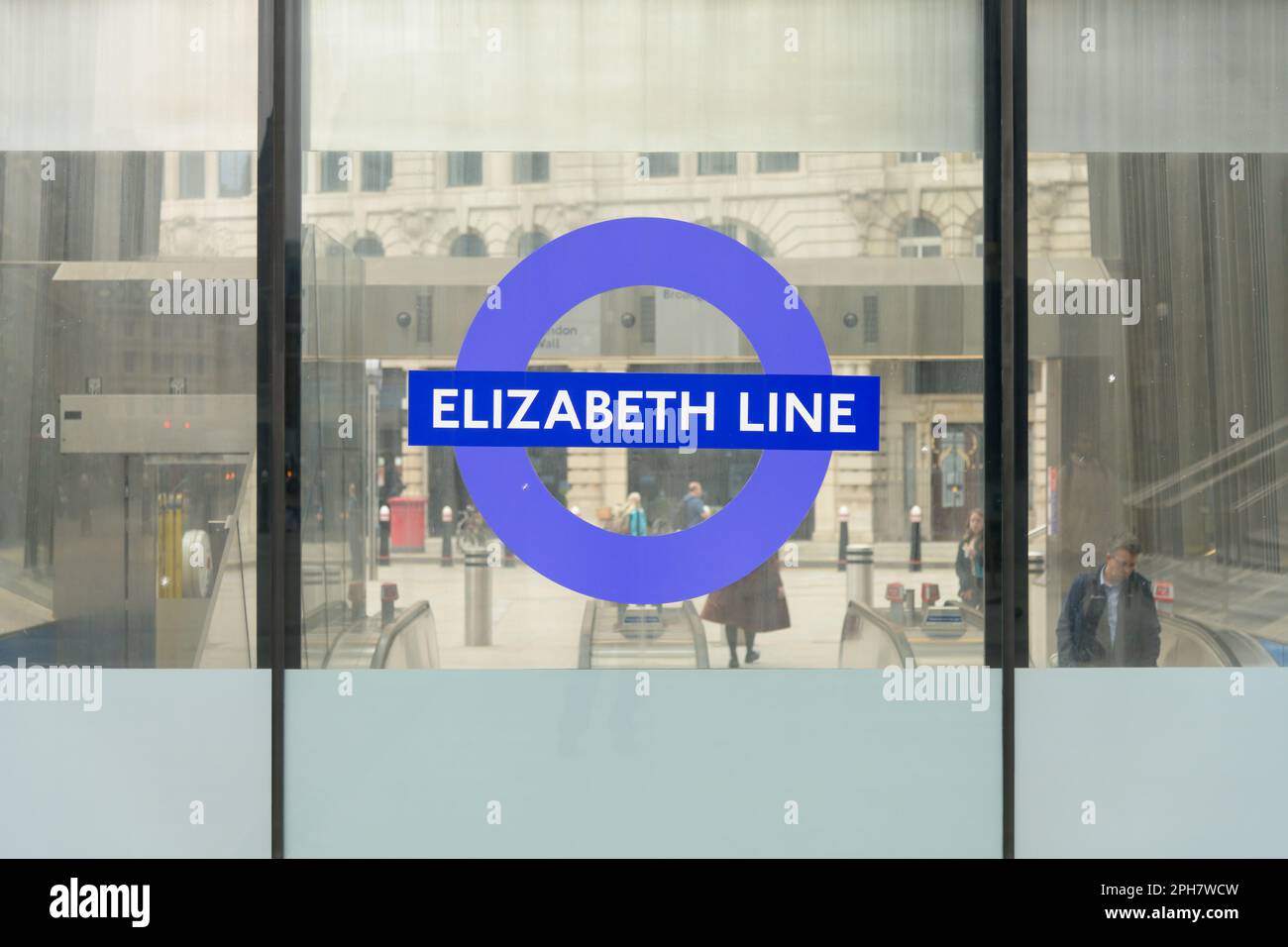 London, UK - March 16 2023; Elizabeth Line Roundel on glass at ...