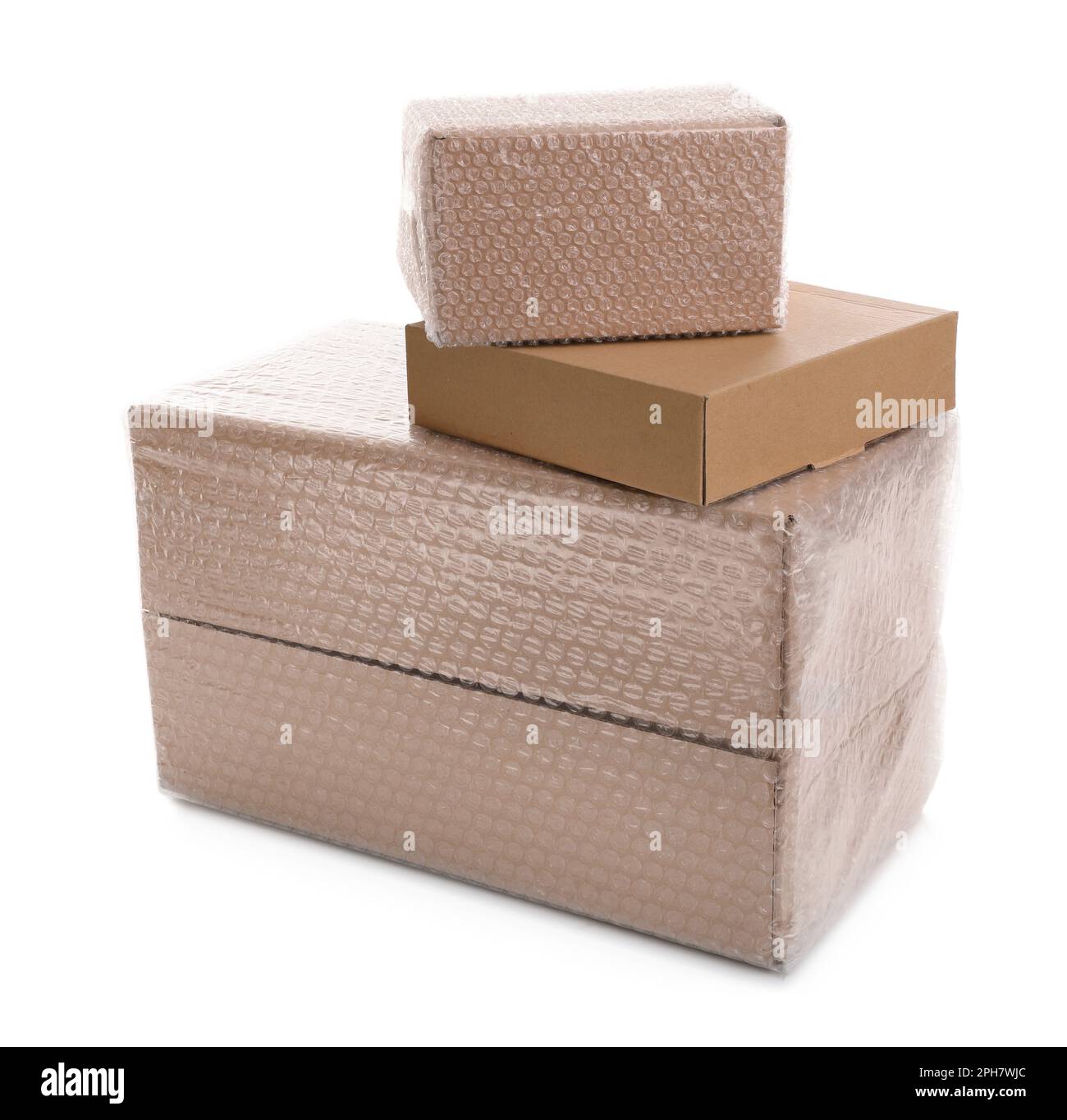 Cardboard boxes packed in bubble wrap and ordinary one on white ...