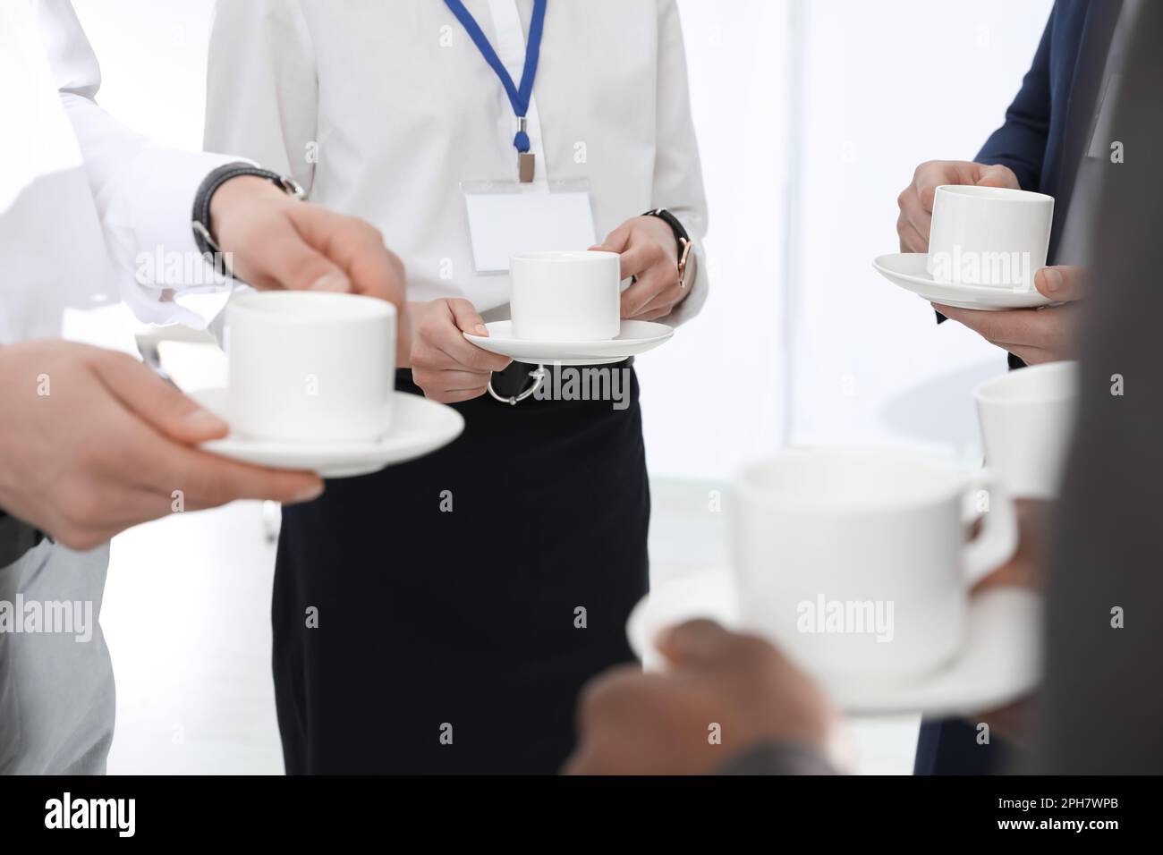 Group of people during coffee break, closeup Stock Photo - Alamy