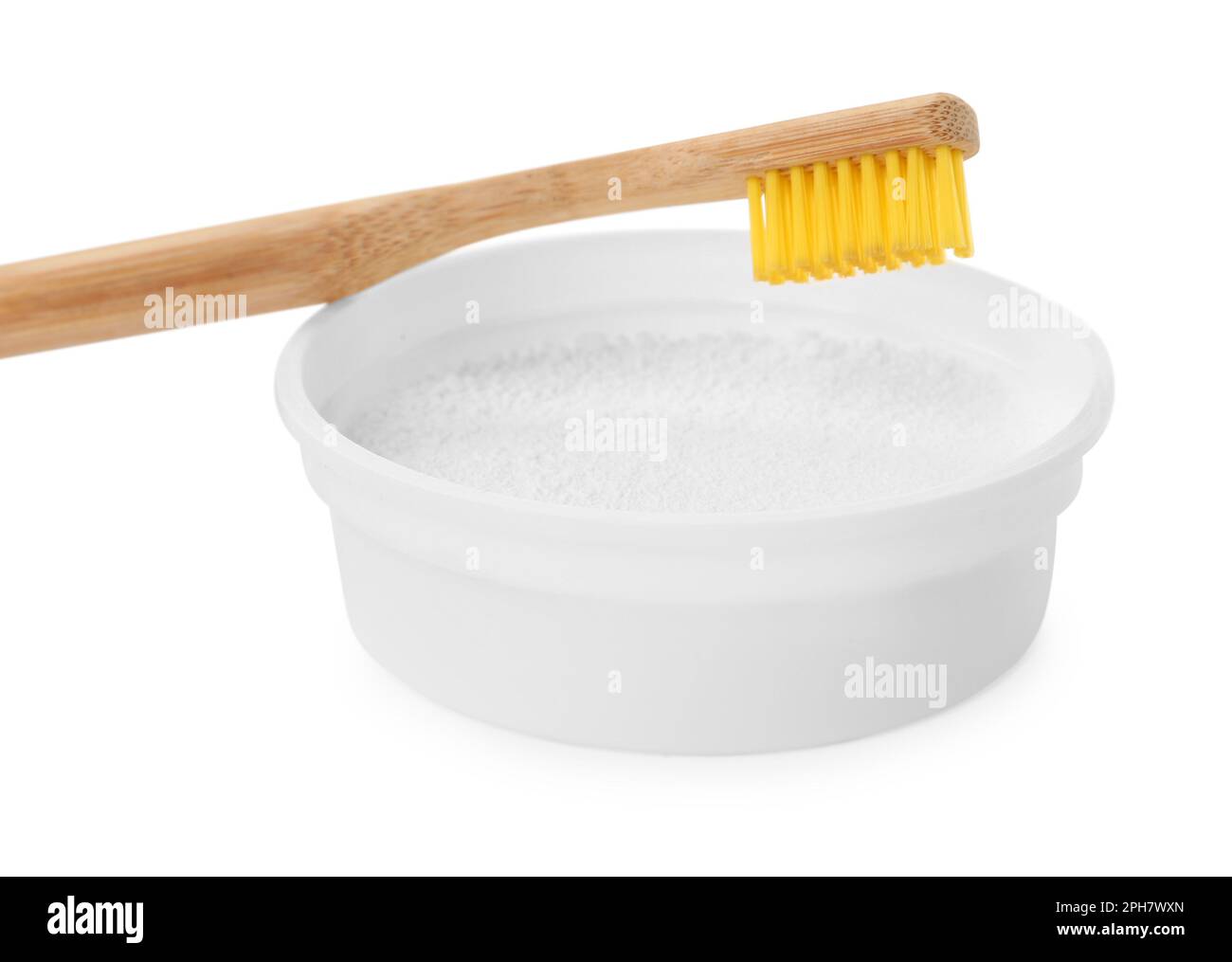 Bowl of tooth powder and brush on white background Stock Photo - Alamy