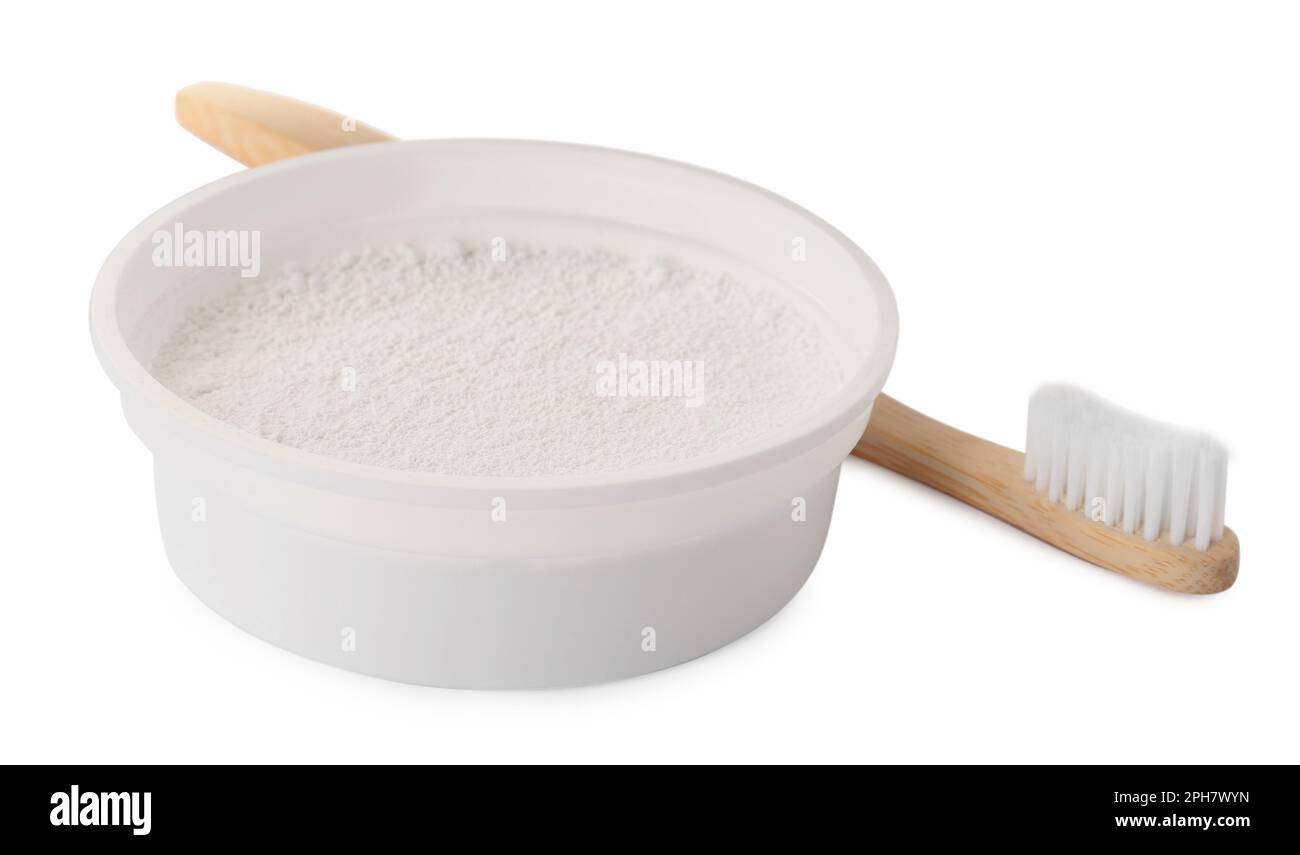 Bowl of tooth powder and brush on white background Stock Photo - Alamy