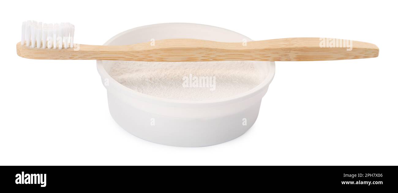 Bowl of tooth powder and brush on white background Stock Photo - Alamy