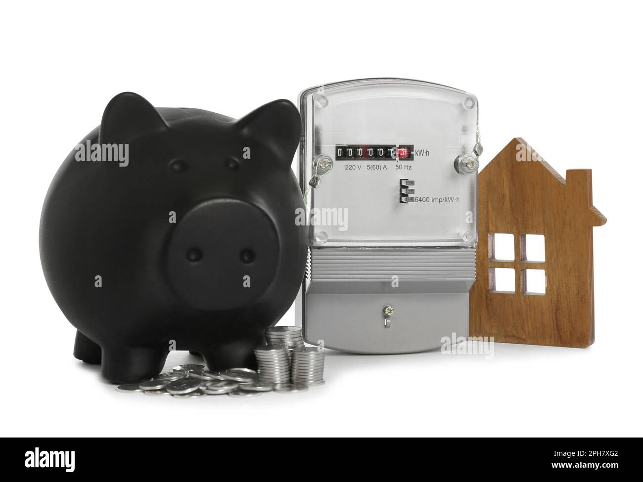 Electricity meter, house model, piggy bank and coins on white ...