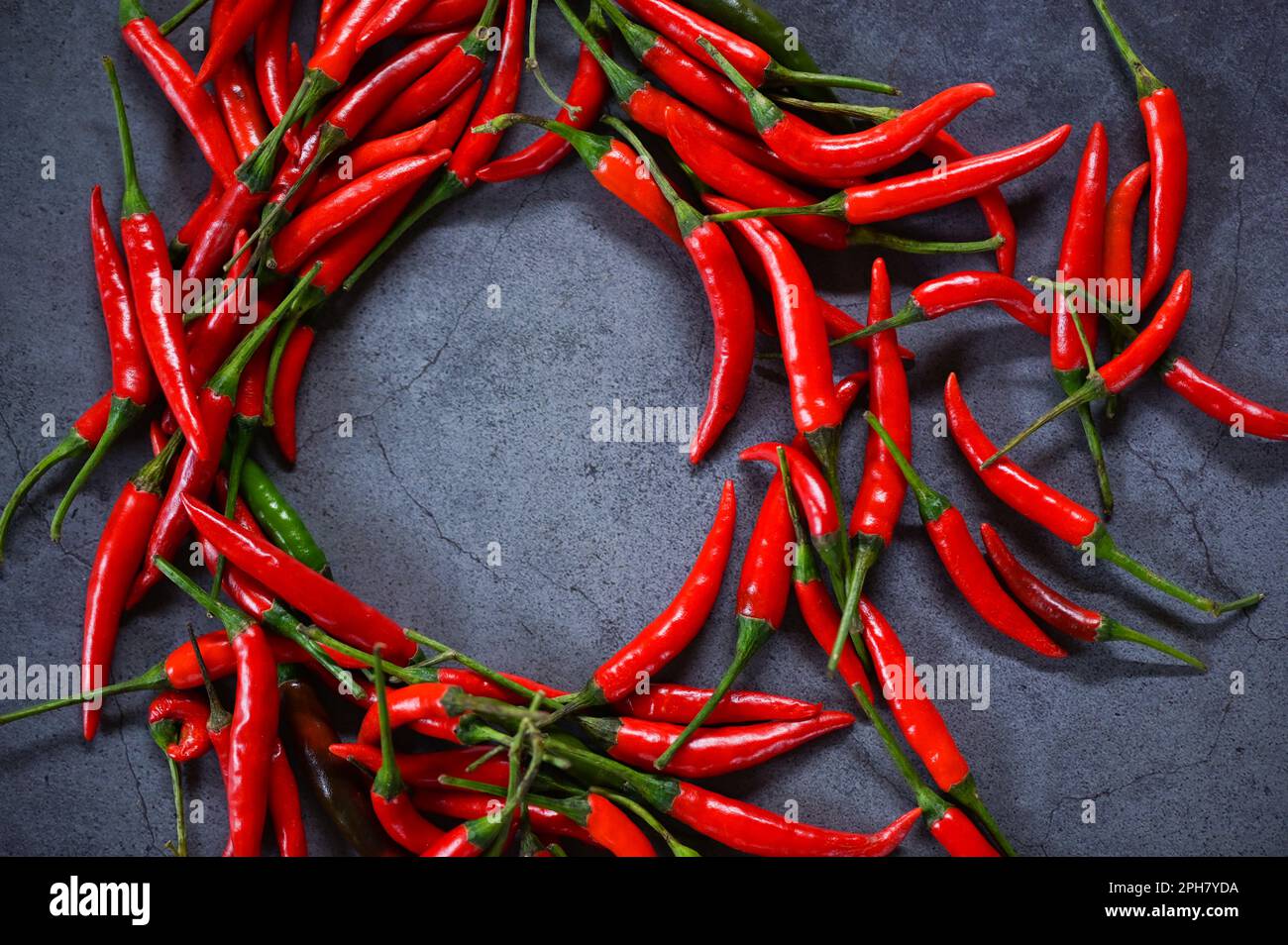 Chili pepper, Red hot chilli peppers on dark background. Close up group ...