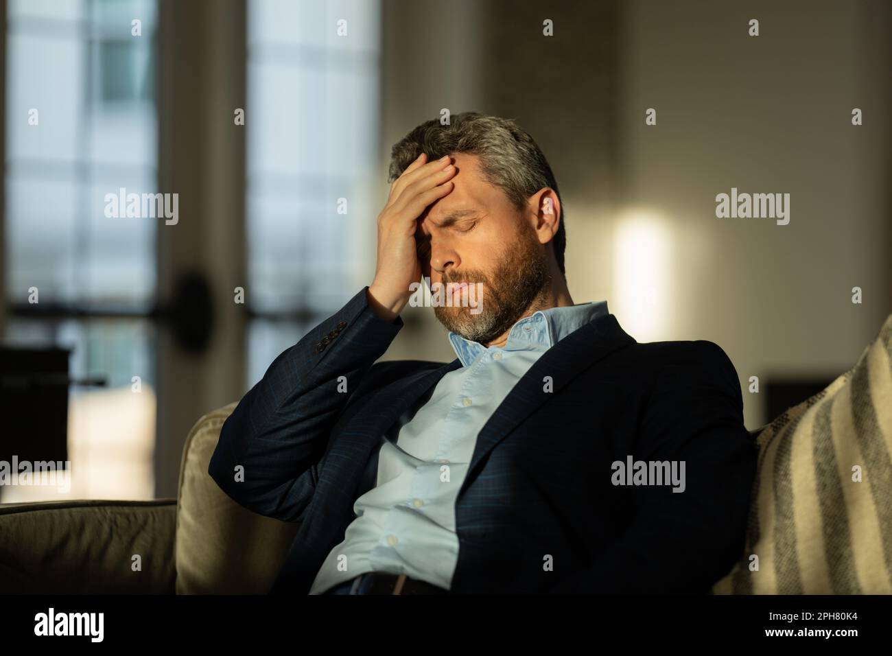 Tired man feel pain head. Close up portrait of stressed man suffer from ...