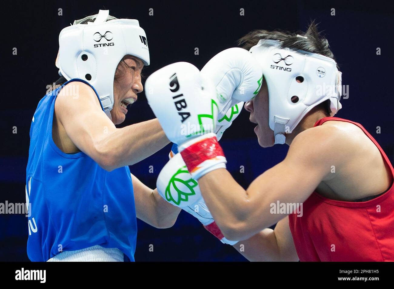 New Delhi, India. 26th Mar, 2023. China's Yang Liu (L) competes with ...