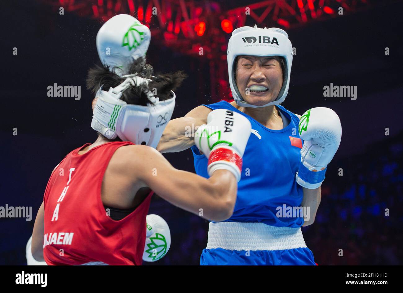 New Delhi, India. 26th Mar, 2023. China's Yang Liu (R) competes with ...