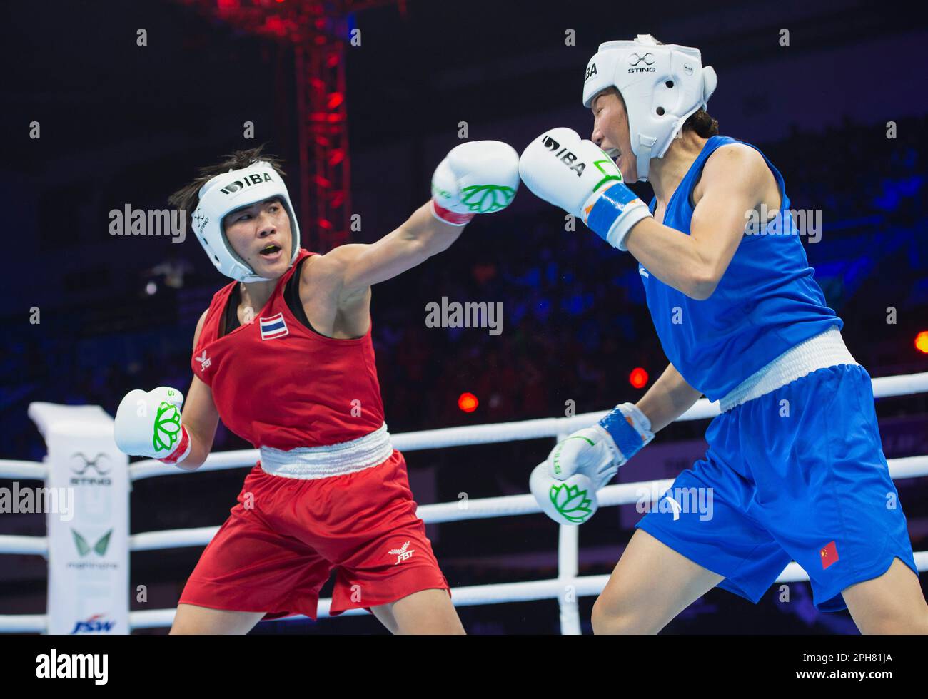 New Delhi, India. 26th Mar, 2023. China's Yang Liu (R) competes with ...