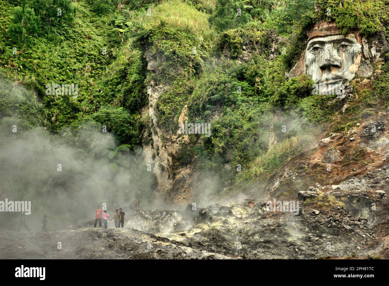 Visitors are having recreational time on fumarole field, in a ...