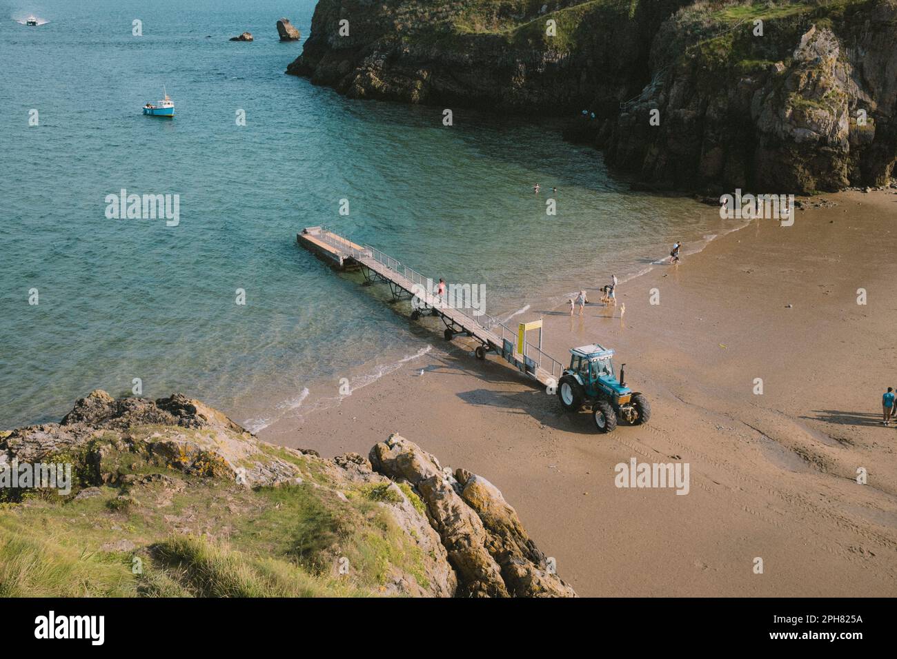 Tractor on beach Stock Photo - Alamy