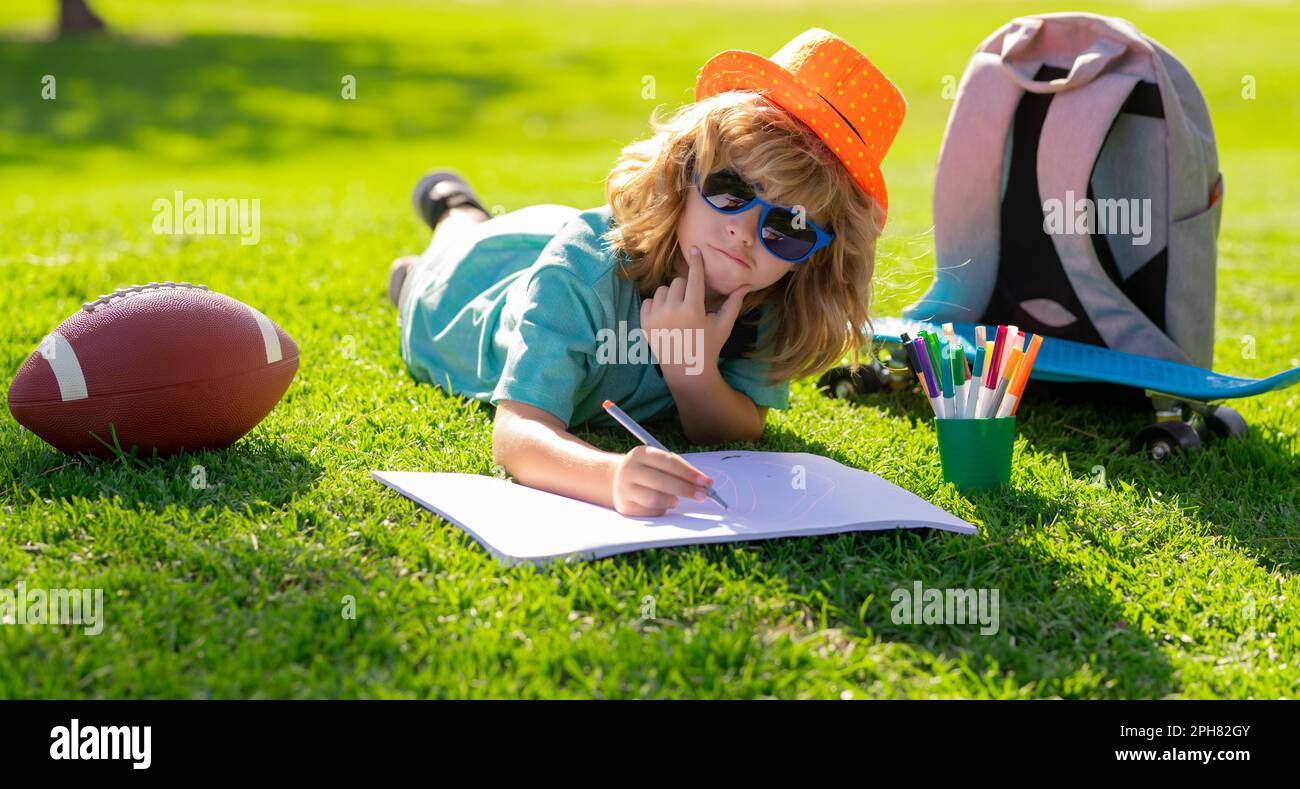 Child drawing picture with crayon in summer park outdoor Stock Photo ...