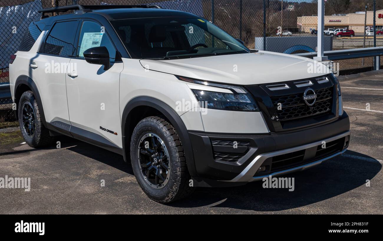 A new, white Nissan Pathfinder Rock Creek SUV for sale at a dealership ...
