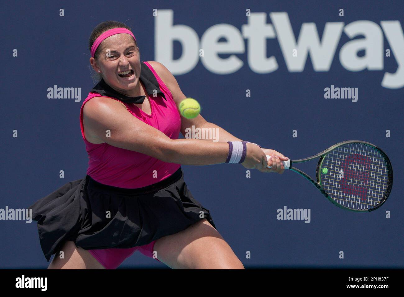 MIAMI GARDENS, FL - MARCH 25: Jelena Ostapenko (LAT) hits a shot during ...