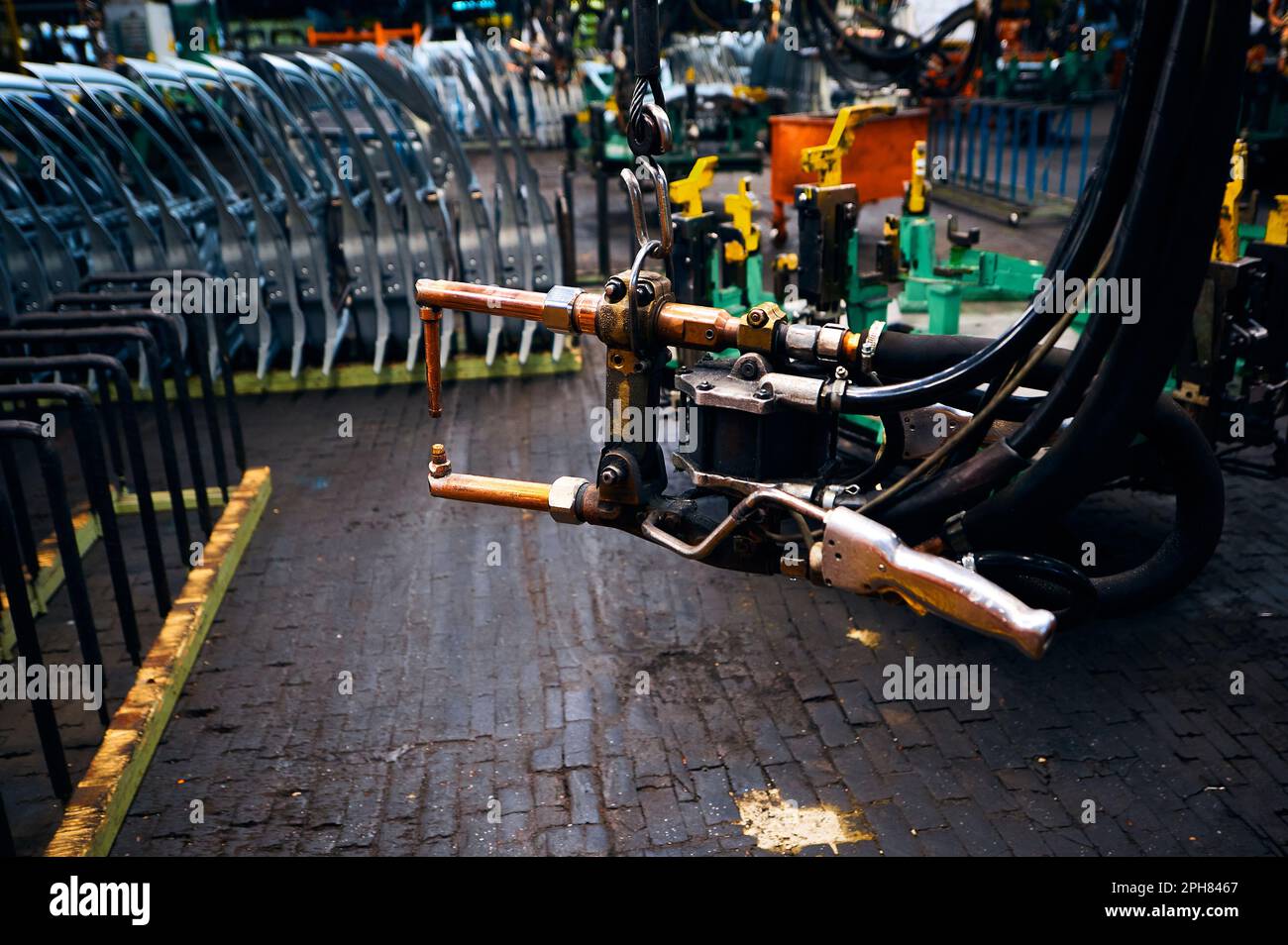 Machine with welding gun for spot weld in plant workshop Stock Photo ...