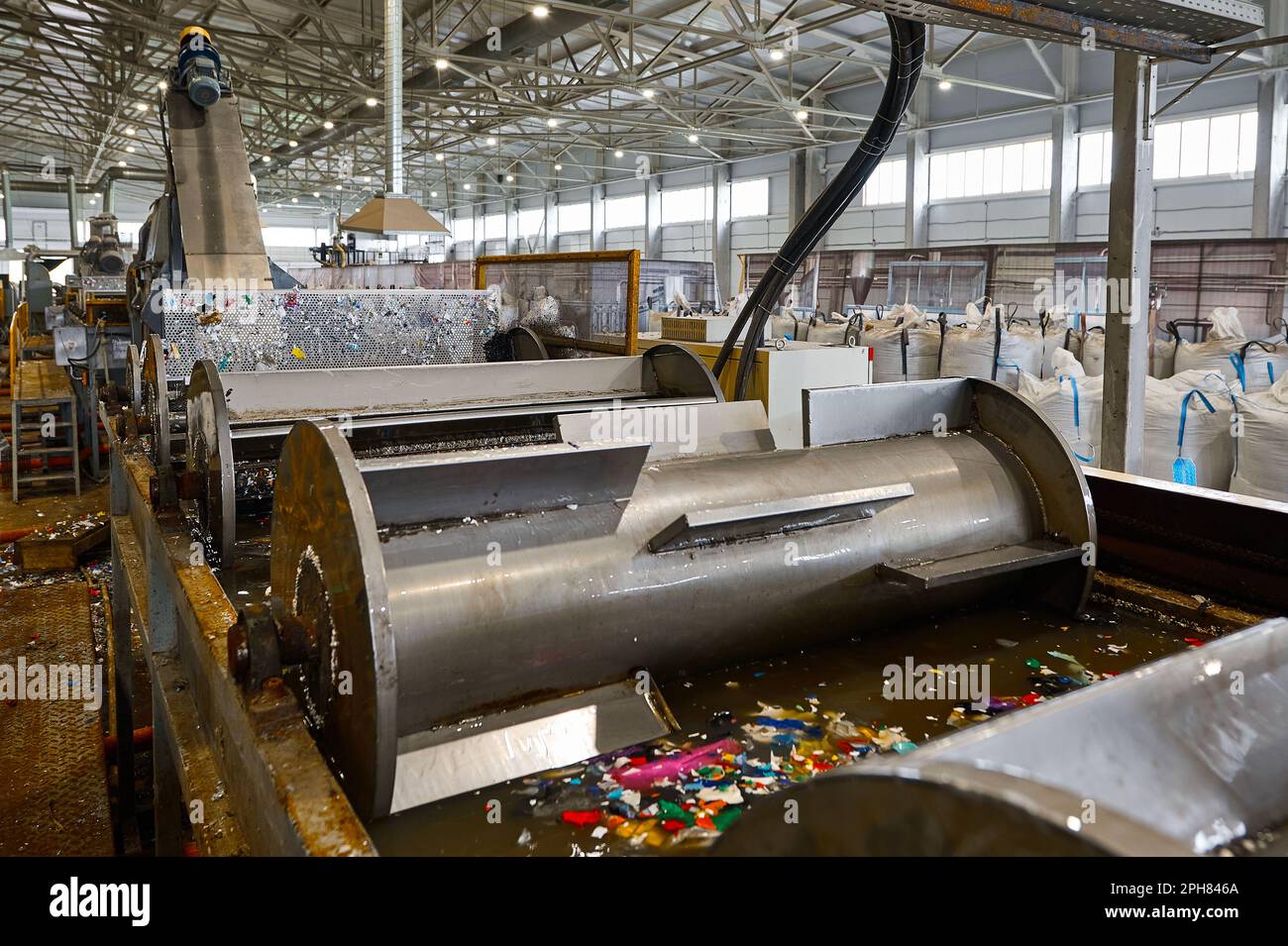 Automatic shredded plastic washing machine. Washing in a bath of water ...