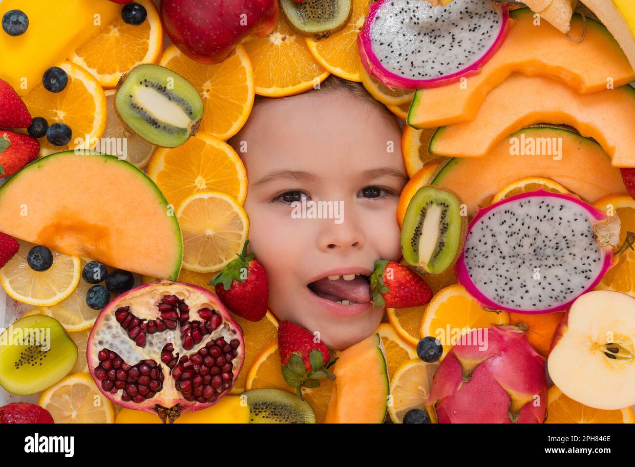 Funny licking fruit. Child face with fruits. Kids face with mix of ...