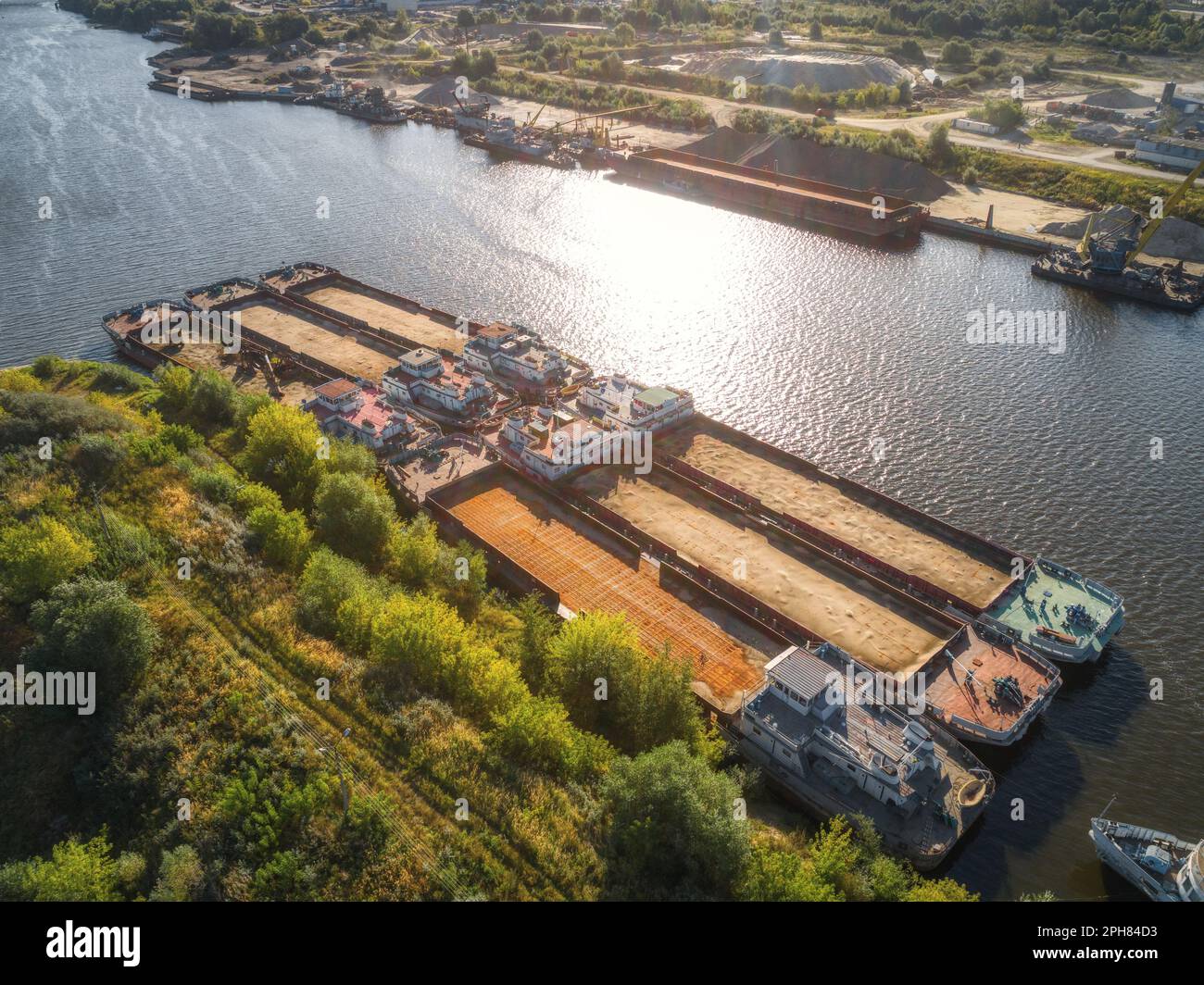 Six self-propelled barges stand at the pier of the river port Stock ...