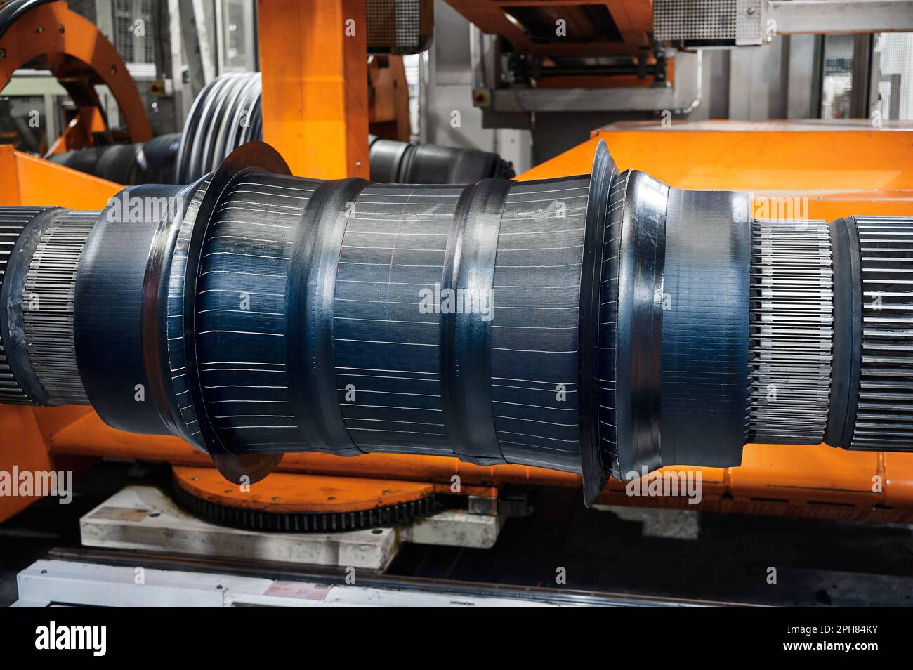 Long shaft with rubber workpieces during tire forming cycle Stock Photo ...