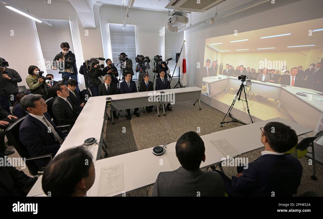 Japanese Prime Minister Fumio Kishida instructs Shunichi Tokura (L), commissioner of the Agency ...