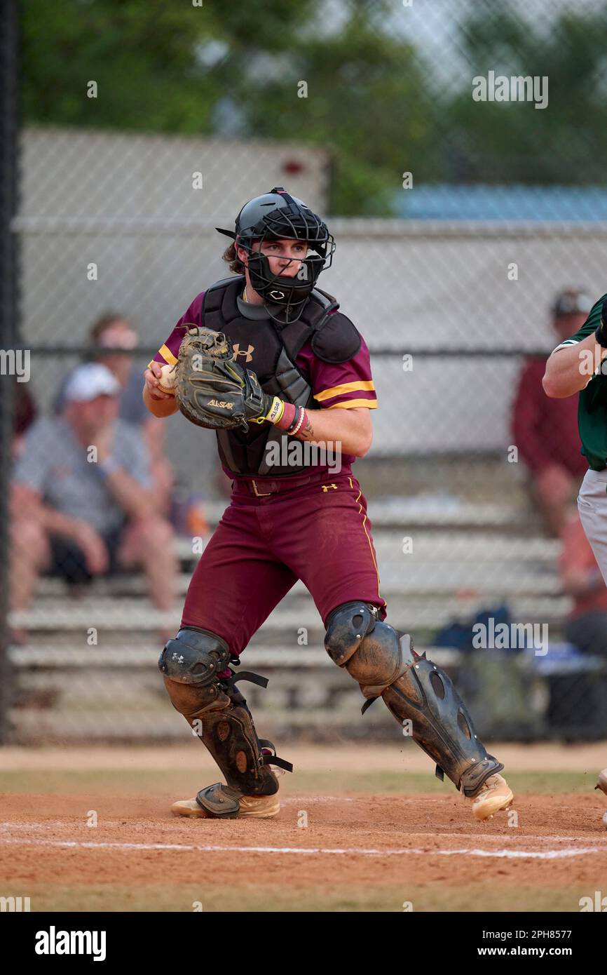 Minnesota Morris Cougars catcher Keegan Jonas (10) checks the runner ...
