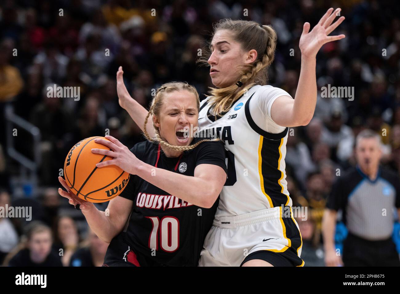 Louisville guard Hailey Van Lith (10) drives past Iowa guard Kate ...