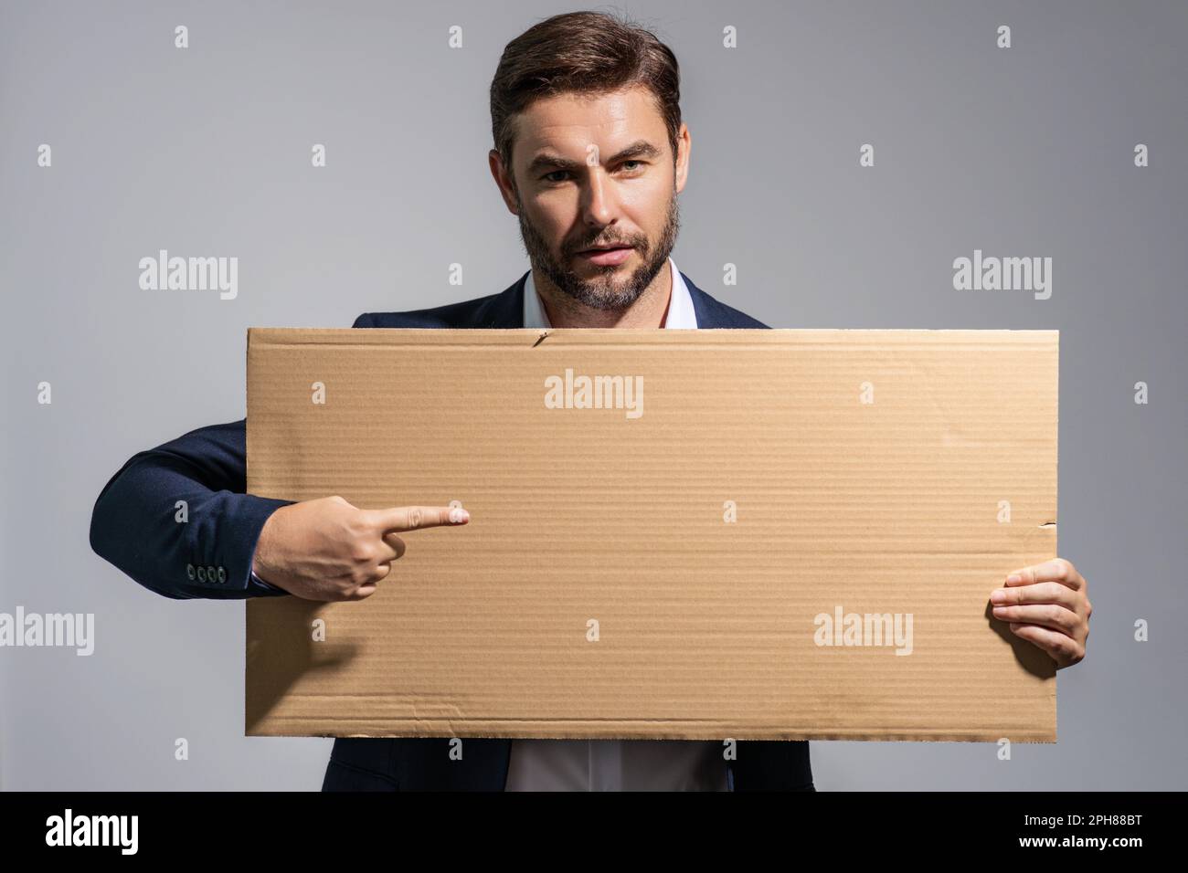 Man in suit holds sign with copy space. Placard ready for copy space ...